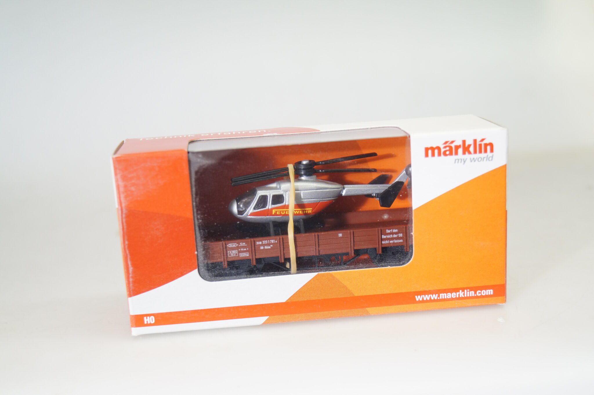 H0: Märklin 4424 Niederbordwagen mit Hubschrauber - neuw./ovp ...